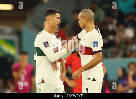 Portugal's Cristiano Ronaldo gives the captain's arm-band to team-mate ...