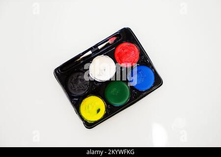 Simple watercolor paints palette isolated on white background, top view ...