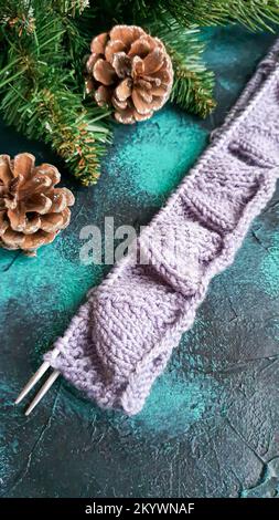 Knitted lilac background. Large knitted fabric with a pattern. Close-up ...