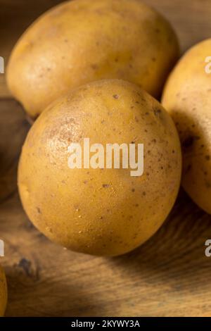 Homemade Raw Yellow Potatoes in a Bunch Stock Photo - Alamy