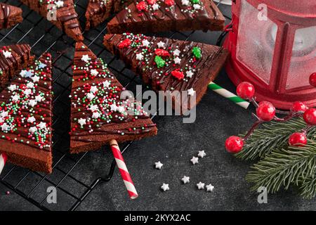 Chocolate brownies Christmas tree with chocolate icing and festive ...