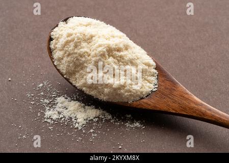 Whey protein powder on a wooden spoon, top view Stock Photo - Alamy
