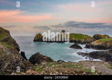 Stunning sunrise over Kynance Cove landscape in Cornwall England with ...