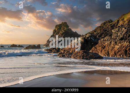 Stunning sunrise over Kynance Cove landscape in Cornwall England with ...