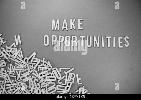 OPPORTUNITIES in wooden English words language capital letters spilling ...