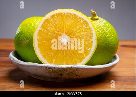 Fresh ripe bergamot orange fruits and tea bags, fragrant citrus used in ...