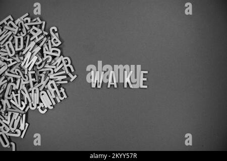 pile of wooden English language capital letters spilling into words ...