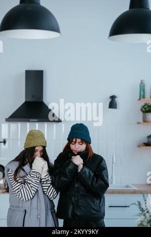 Warmly dressed women are upset with the heating turned off Stock Photo ...