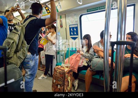 SINGAPORE - NOVEMBER 07, 2015: passengers in MRT train. The Mass Rapid ...