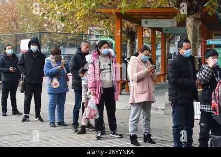 FUYANG, CHINA - DECEMBER 3, 2022 - People queue for free nucleic acid ...