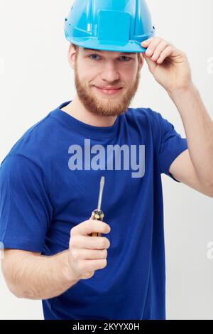 young handsome guy with a screwdriver Stock Photo - Alamy