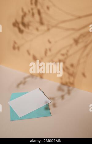 Beige envelope with blank letter on pink wooden desk Stock Photo - Alamy