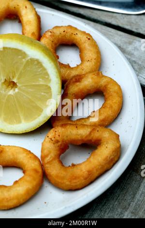 Calamari rings in the plate Stock Photo - Alamy