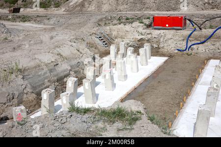 Concrete piles foundation for a new building on construction site ...