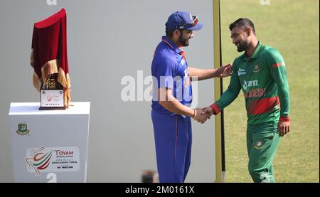 Bangladeshi Captain Liton Kumar Das ® and Indian Captain Rohit Sharma (L) unveil the trophy of ...