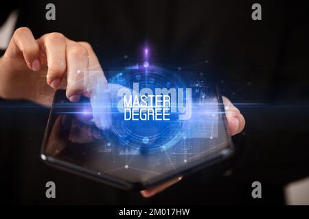 Young man holding a foldable smartphone Stock Photo - Alamy
