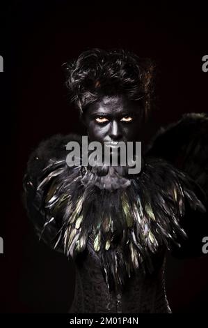Woman with harpy makeup - mystical creature, isolated on black Stock ...
