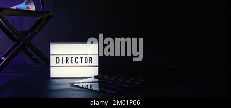 Director chair with cinema lightbox sign Director text on it and ...