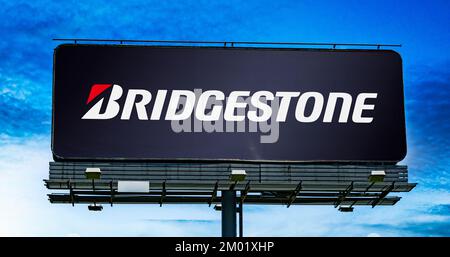 Advertisement billboard displaying logo of Bridgestone Stock Photo - Alamy