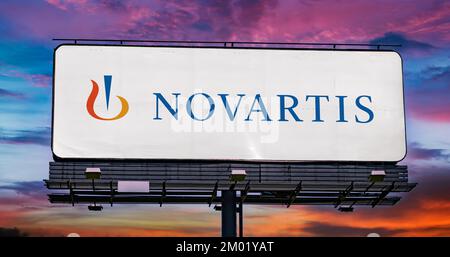 Advertisement billboard displaying logo of Novartis Stock Photo - Alamy