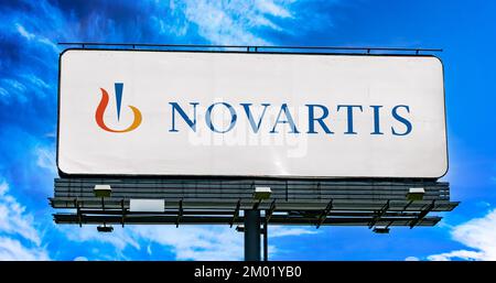 Advertisement billboard displaying logo of Novartis Stock Photo - Alamy