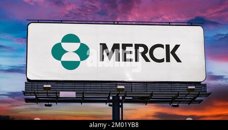 Advertisement billboard displaying logo of Merck Stock Photo - Alamy