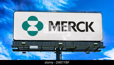 Advertisement billboard displaying logo of Merck Stock Photo - Alamy