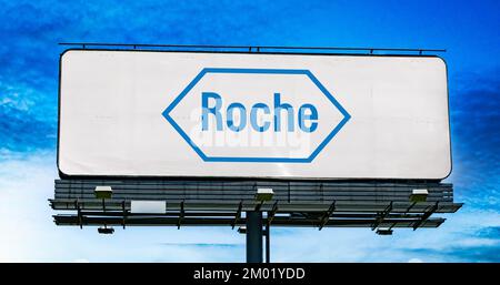 Advertisement billboard displaying logo of Roche Stock Photo - Alamy
