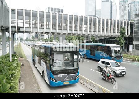 Trans Jakarta bus in bus way line, at the rush hour traffic. Location ...