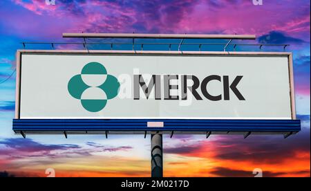 Advertisement billboard displaying logo of Merck Stock Photo - Alamy