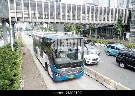 Trans Jakarta bus in bus way line, at the rush hour traffic. Location ...
