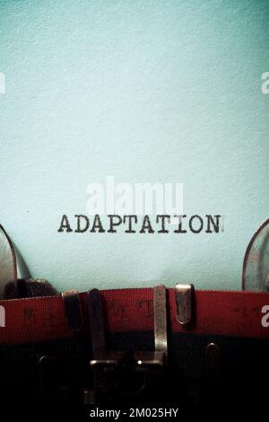 Adaptation word written with a typewriter Stock Photo - Alamy