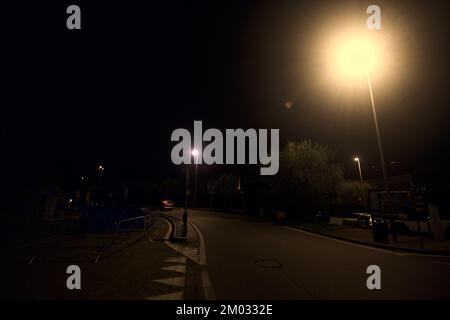 Small square with street lamps at night Stock Photo - Alamy