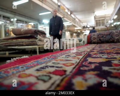 Tehran, Tehran, Iran. 3rd Dec, 2022. Iranian carpet vendors wait for ...