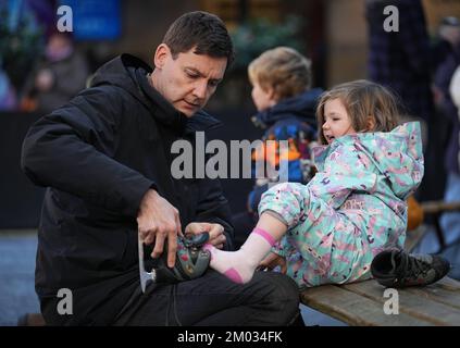 B.C. Premier David Eby puts on skates as he and his wife Cailey Lynch ...