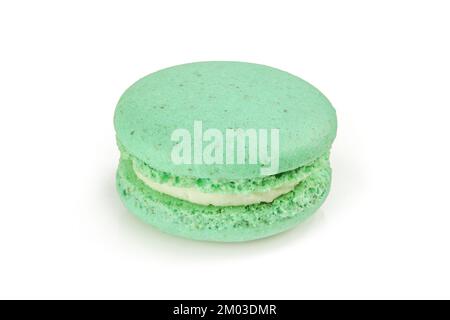 Single green macaroon with green filling cream isolated on white ...