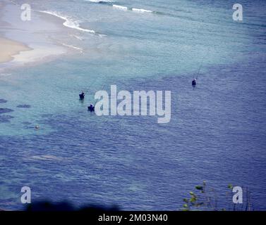 Local indigenous Bajau men fishing at the Tip of Borneo, Sabah ...