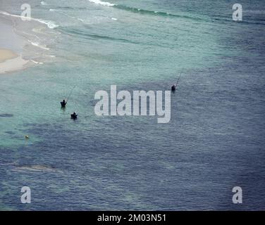 Local indigenous Bajau men fishing at the Tip of Borneo, Sabah ...