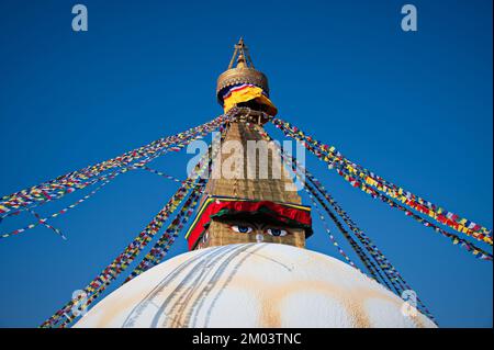 Low angle view of Boudhnath Stupa, one of the biggest Buddhist shrines ...