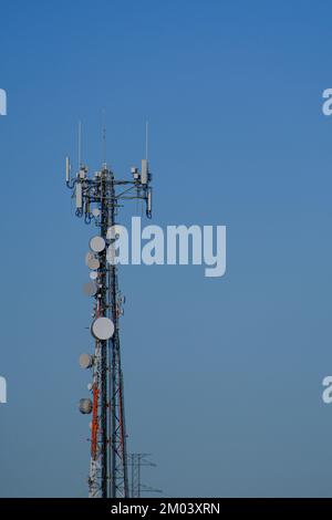 RF Communication transmission towers under cloudy sky Stock Photo - Alamy