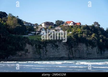 Houses on hillside above Orewa estuary, Auckland, North Island, New ...