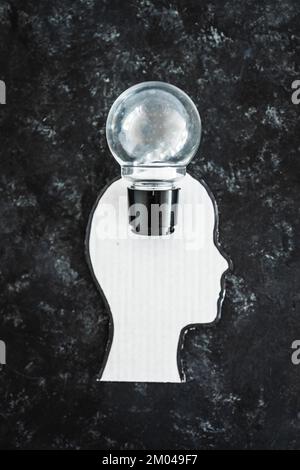 cardboard head silhouette with light bulb metaphor of ideas on my mind ...
