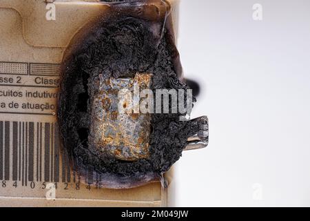 Macro photography of a burnt electrical circuit breaker with melted ...