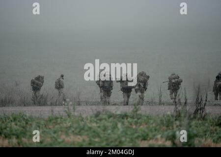 army soldiers on a military tabbing exercise with 40Kg bergen and anti ...