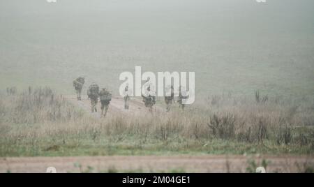 army soldiers on a military tabbing exercise with 40Kg bergen and anti ...