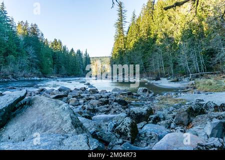 Large rocks line the Snoqaulmie River in Washington State Stock Photo ...