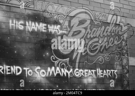 A tribute mural to Brandon McGhee spray painted on an inner city ...