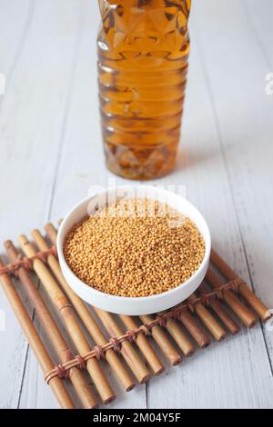 Mustard oil and seed on table with copy space Stock Photo - Alamy