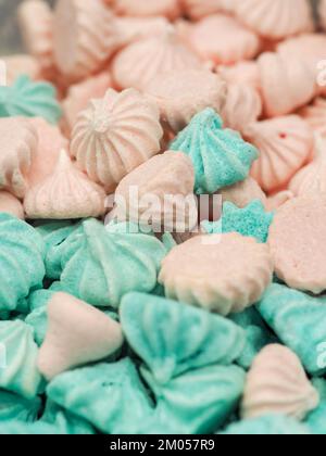bunch of pink and light blue meringues for cake and sweets decoration ...