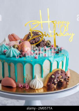 donuts meringue berries and sparkles topping on frosted icing drip ...